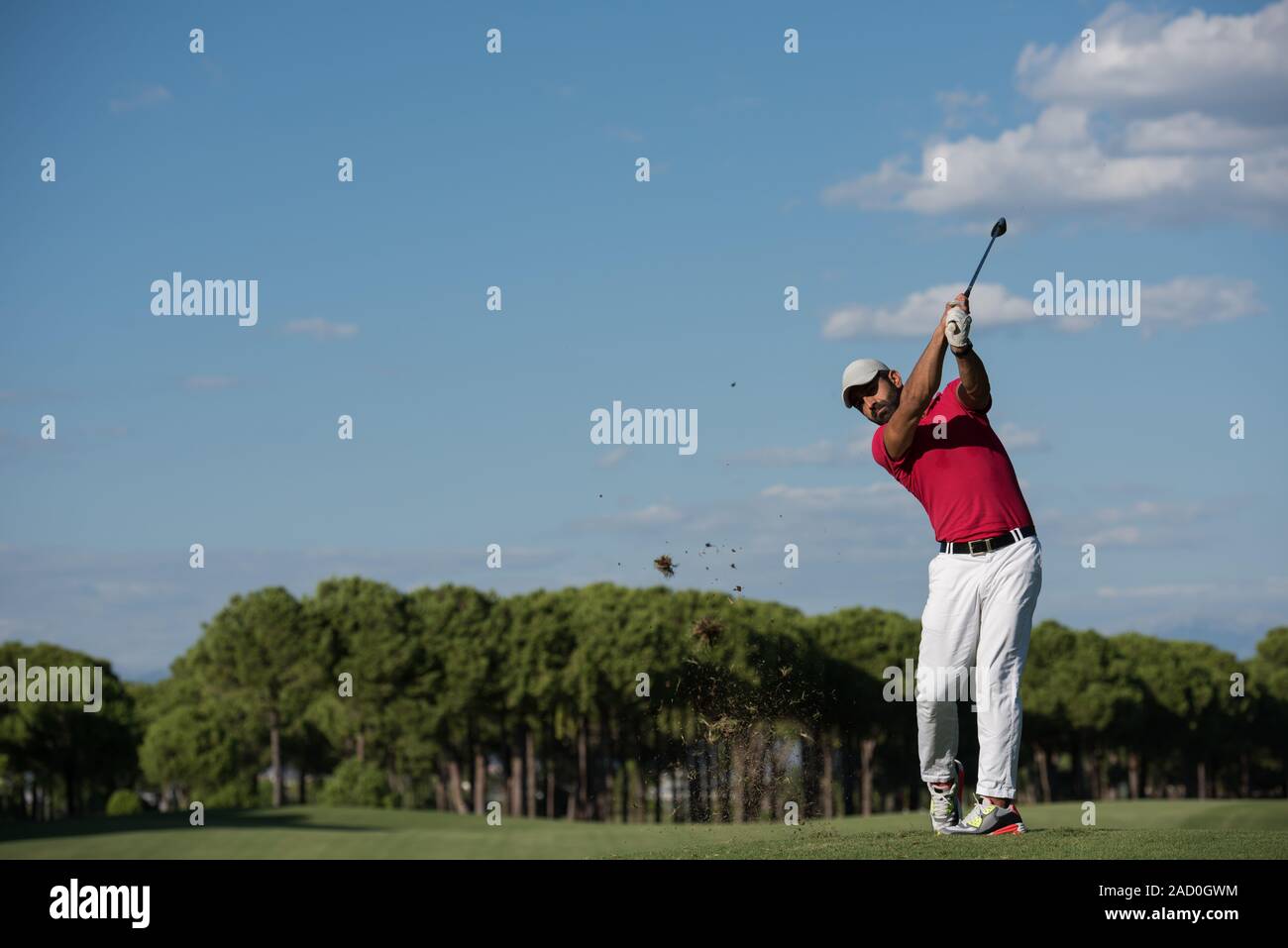 golf player hitting long shot Stock Photo - Alamy