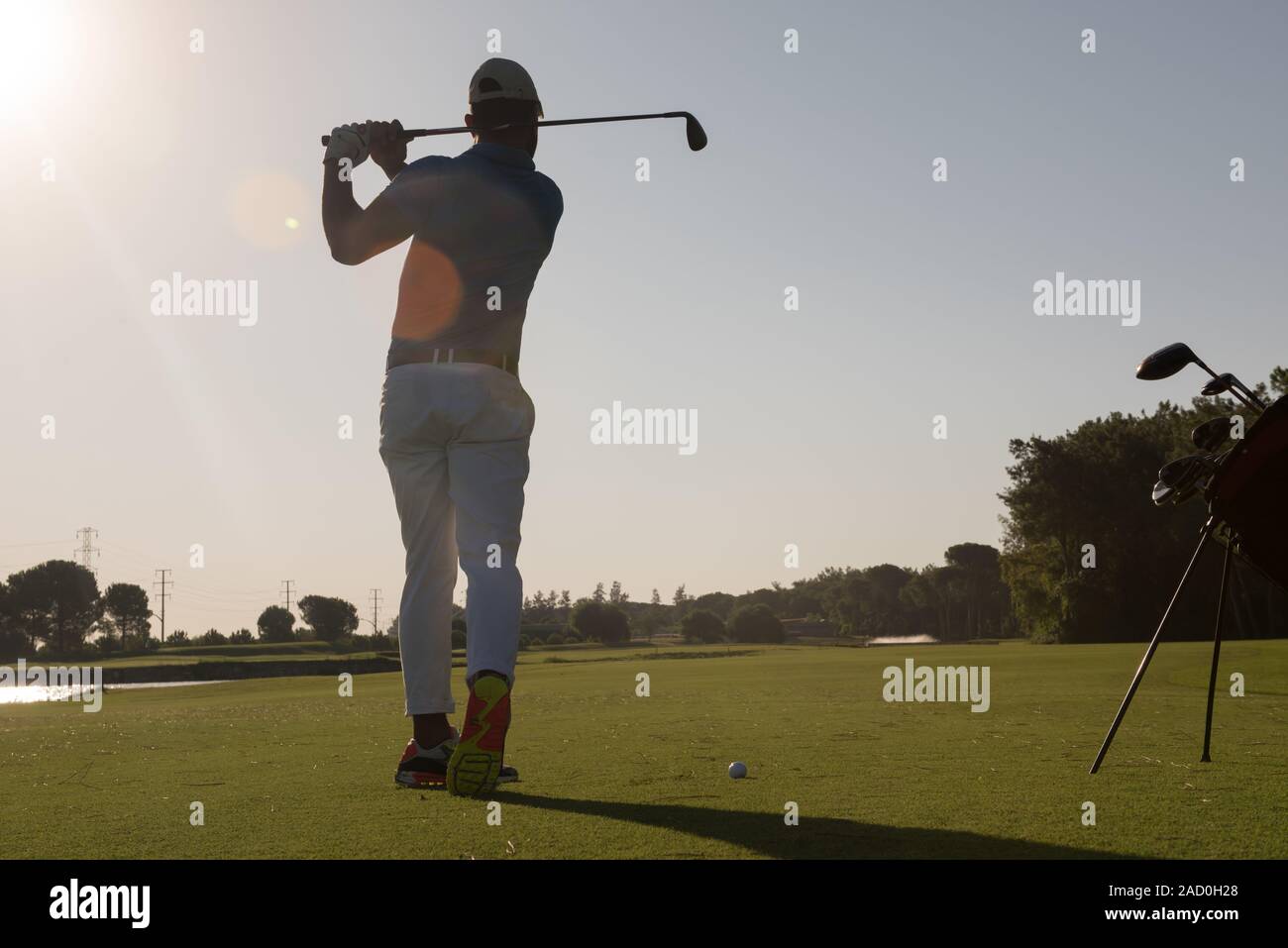 golf player hitting shot Stock Photo - Alamy