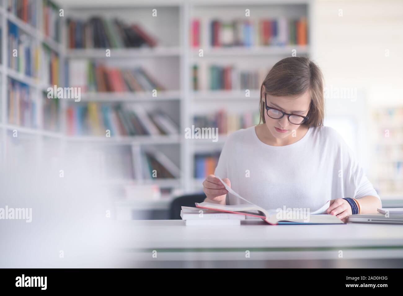 female student study in school library Stock Photo - Alamy