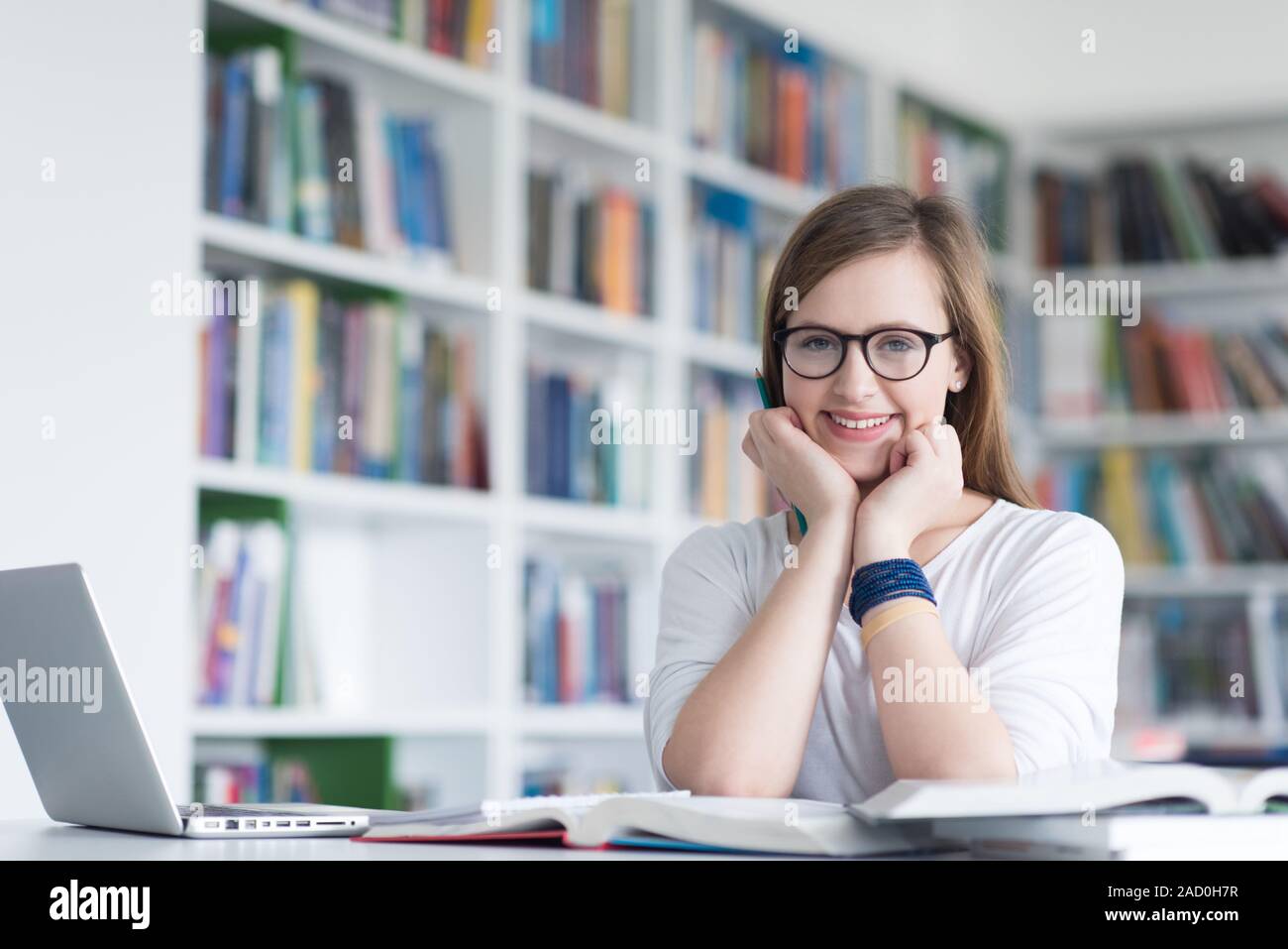 female student study in school library Stock Photo - Alamy
