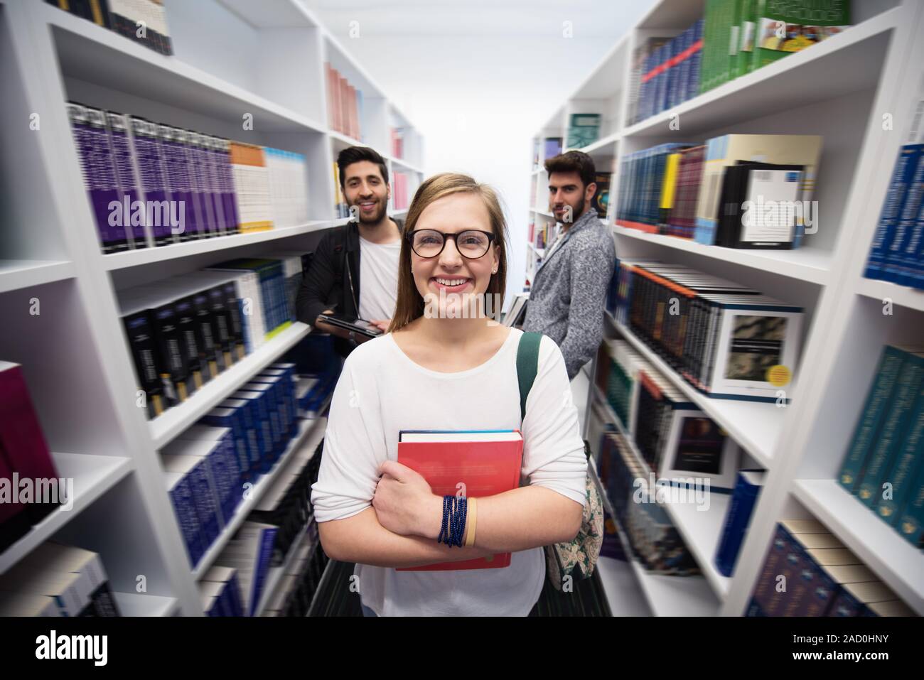 students group in school library Stock Photo - Alamy