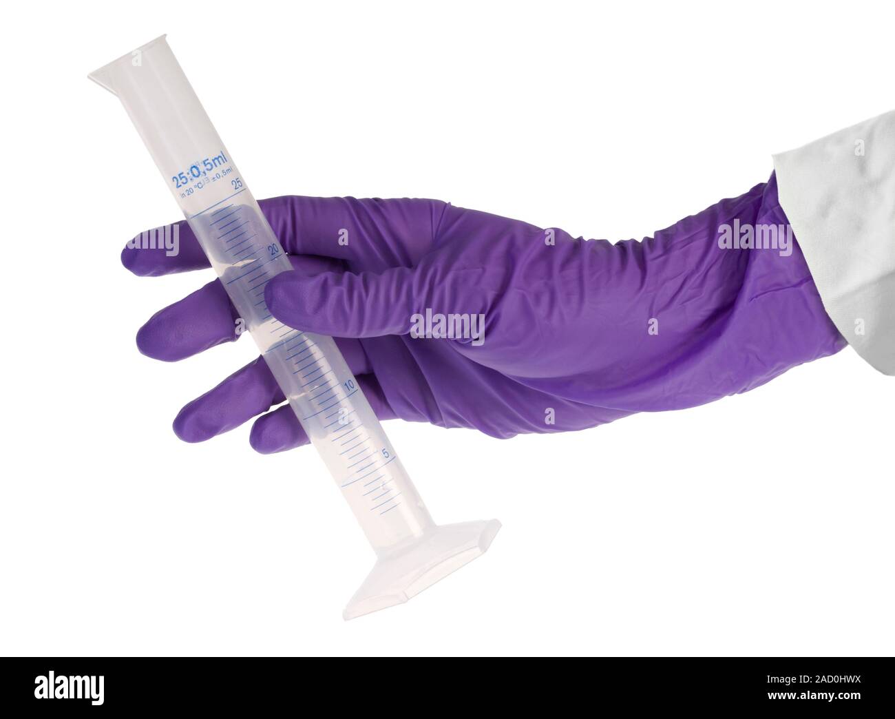 Lab equipment. Gloved hand holding measuring flask Stock Photo - Alamy