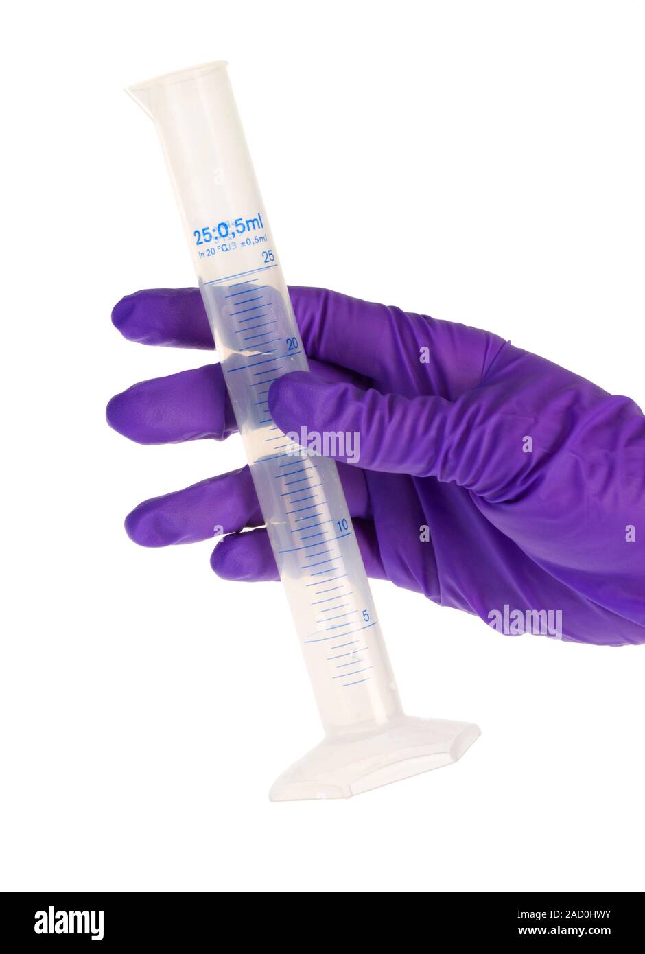 Lab equipment. Gloved hand holding measuring flask Stock Photo - Alamy