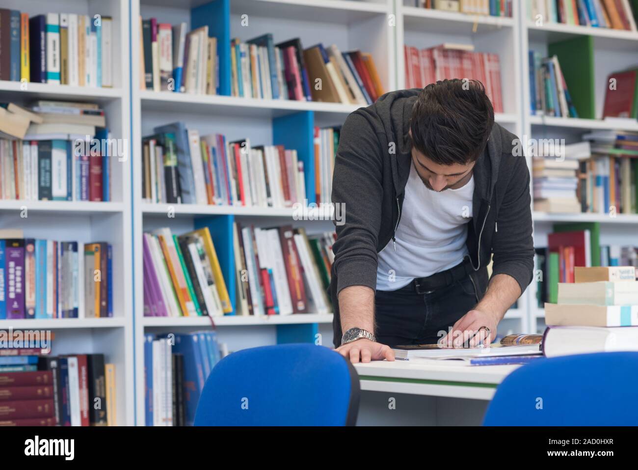 student study in school library Stock Photo - Alamy