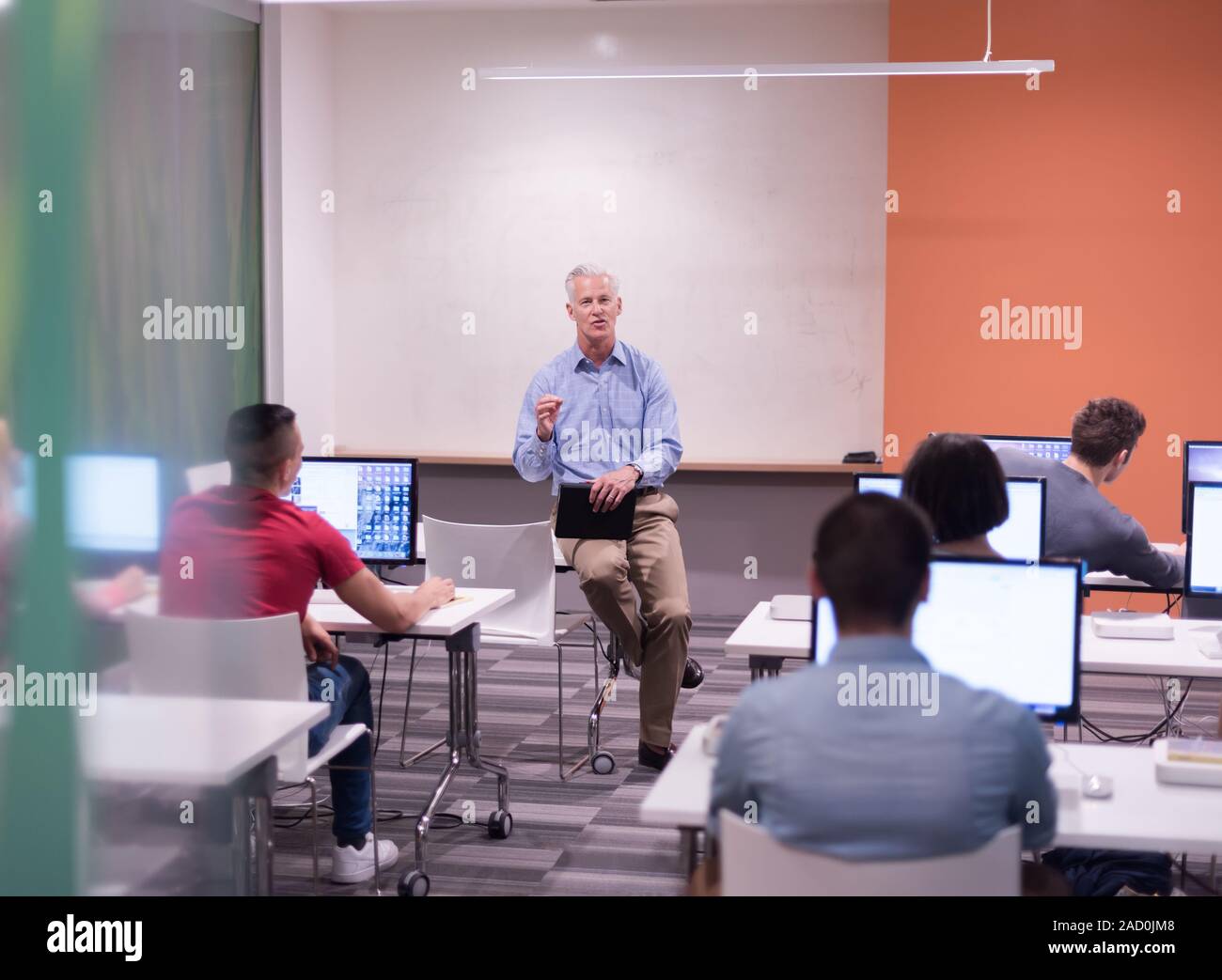 teacher and students in computer lab classroom Stock Photo - Alamy