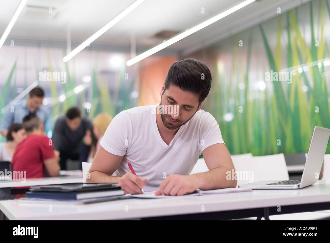 male student in classroom Stock Photo - Alamy