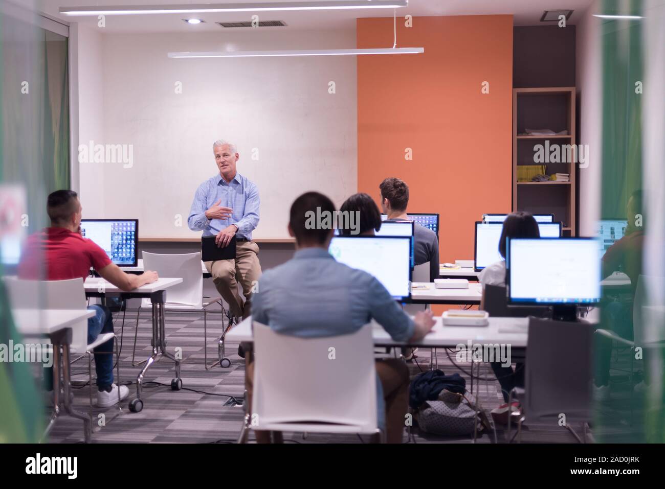 teacher and students in computer lab classroom Stock Photo - Alamy