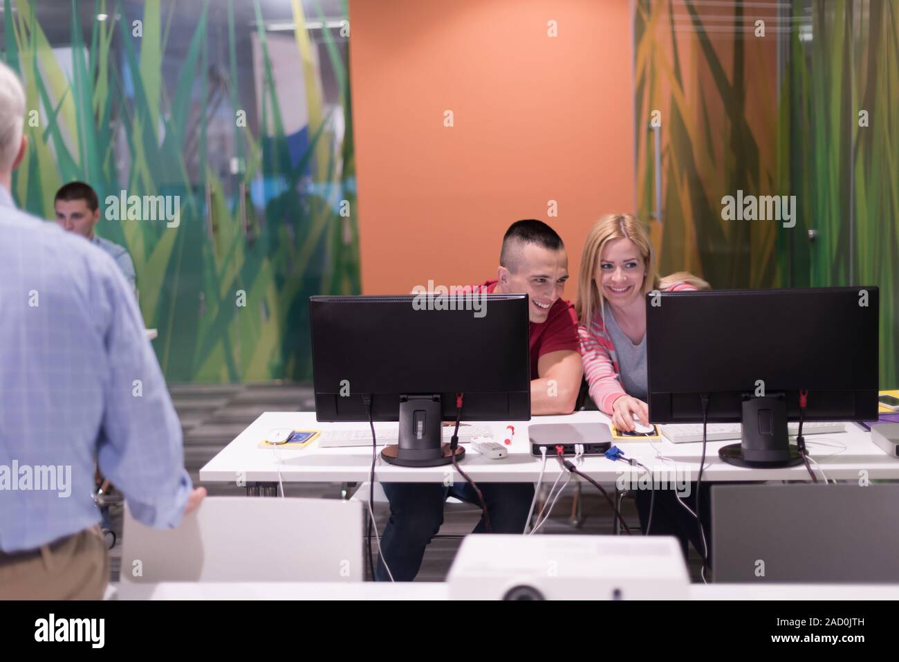 teacher and students in computer lab classroom Stock Photo - Alamy
