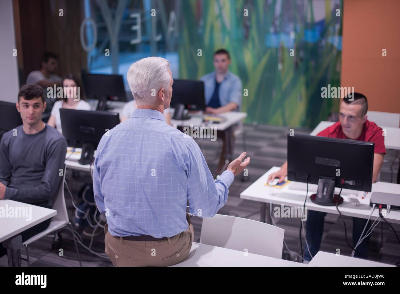 teacher and students in computer lab classroom Stock Photo - Alamy