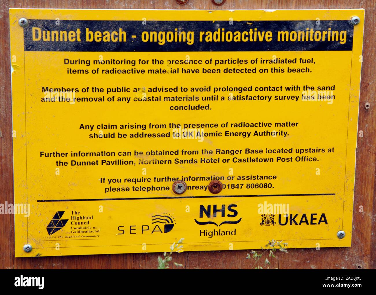 Dunnet beach radiation monitoring. Sign warning the public to avoid ...