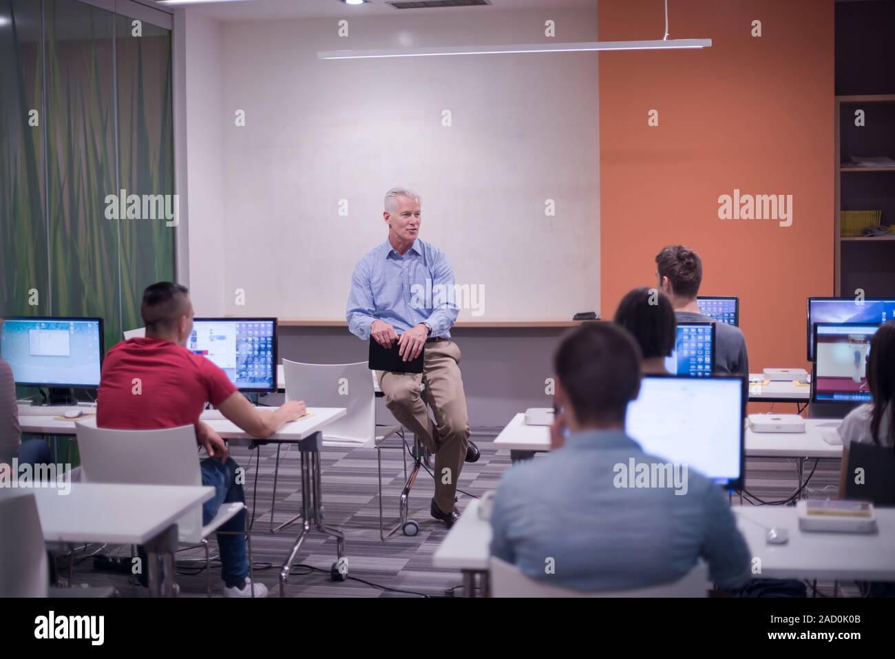 teacher and students in computer lab classroom Stock Photo - Alamy