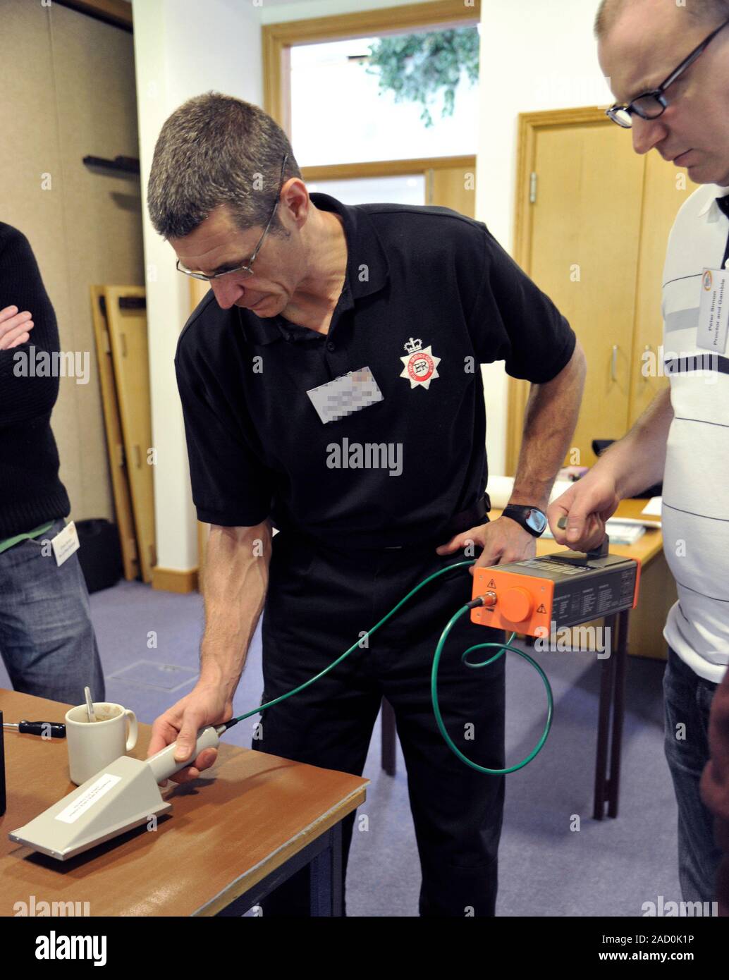Radiation emergency response training. Fire service trainer showing how ...