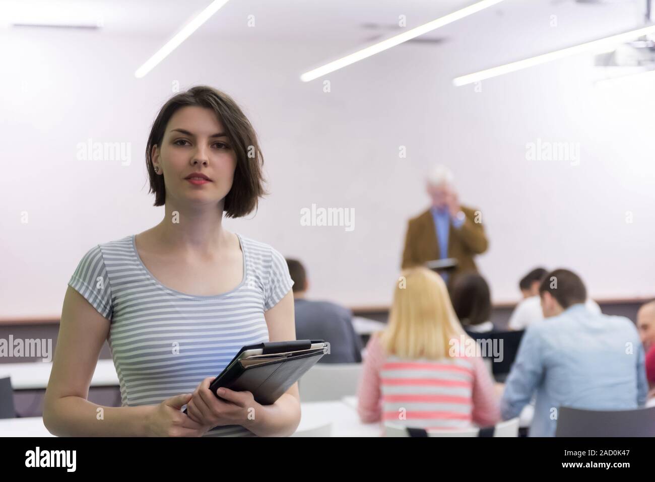 portrait of happy female student in classroom Stock Photo - Alamy