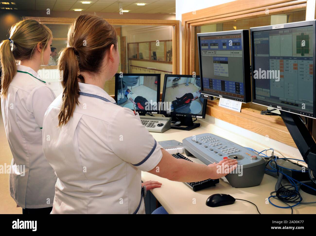 Hospital radiography control room. Medical workers in a control room in ...