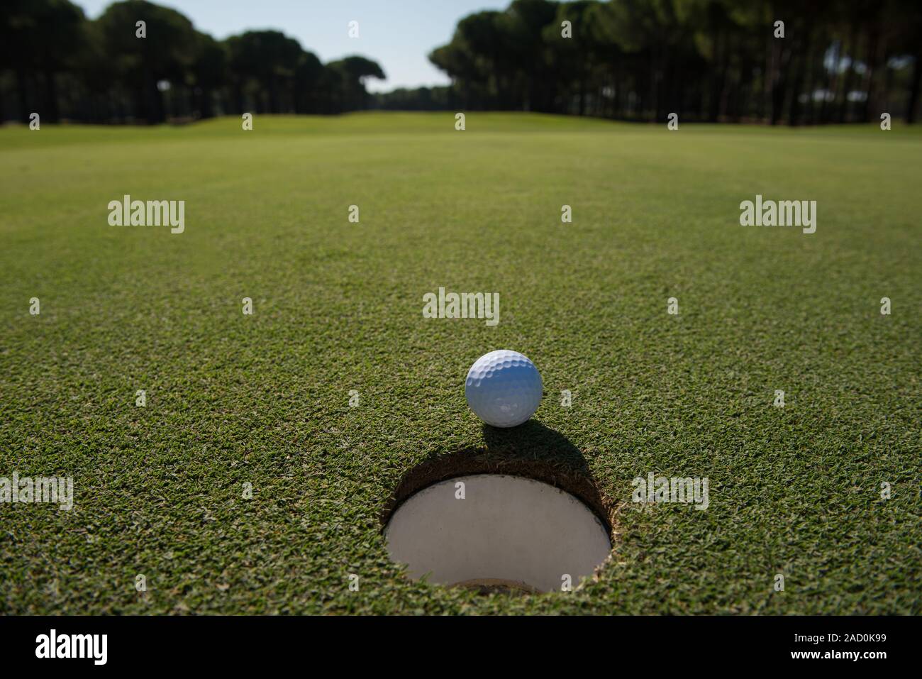 golf ball in the hole Stock Photo - Alamy