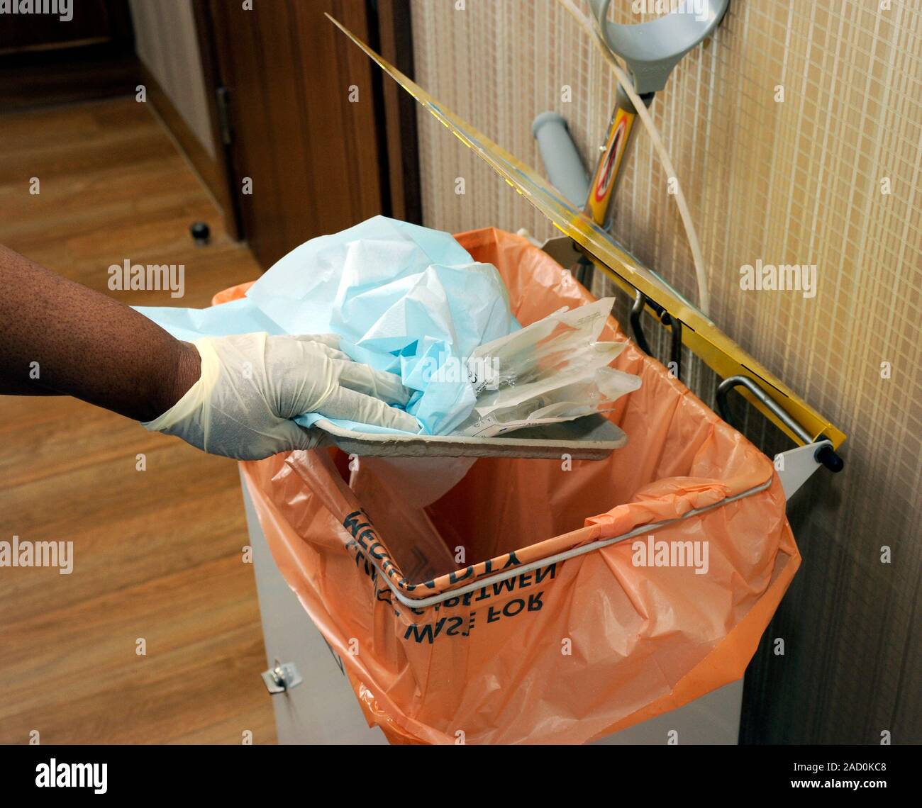 Hospital waste disposal routine. Hospital waste being placed in a ...