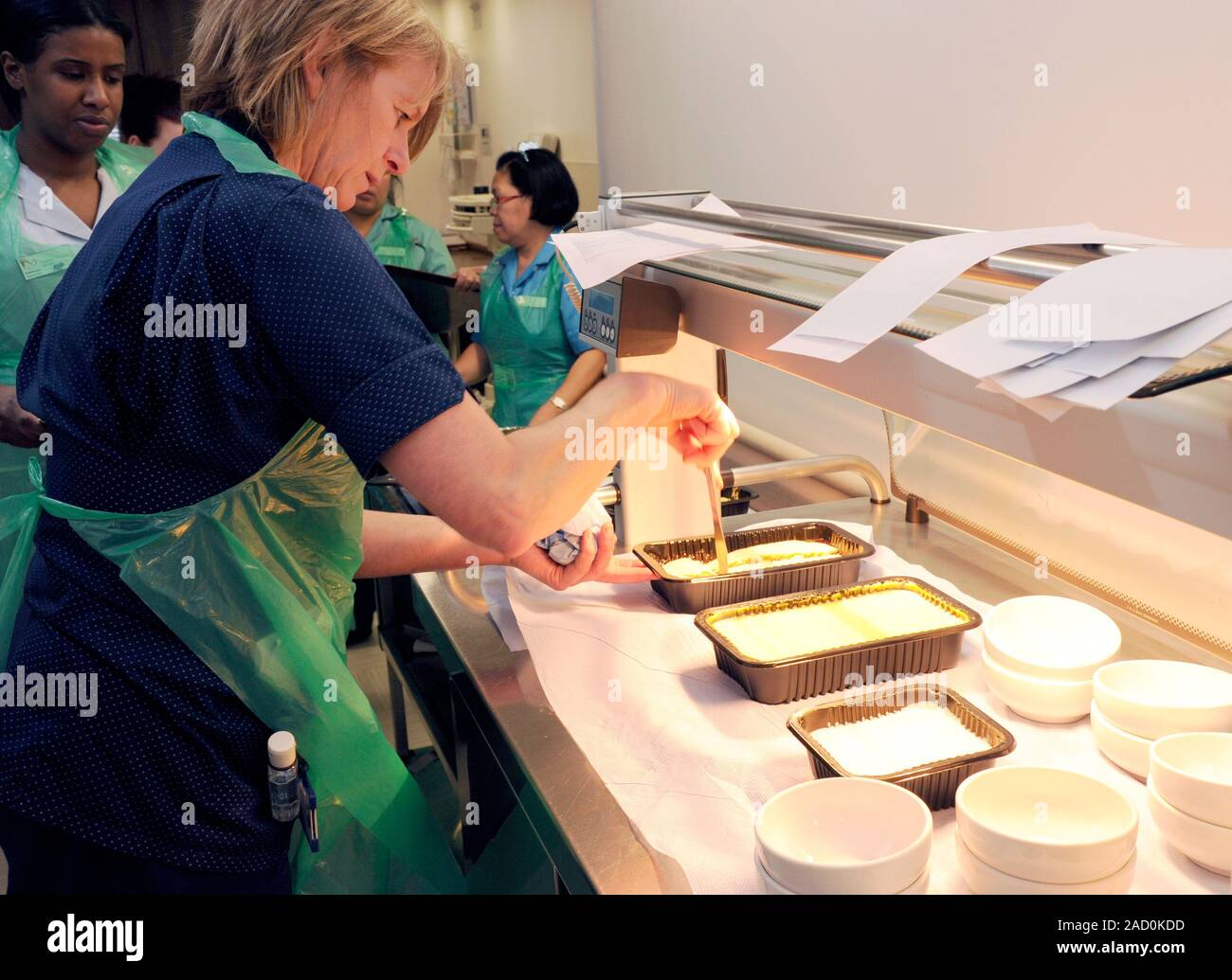 Serving hospital food. Cooked hospital food being served from pre ...