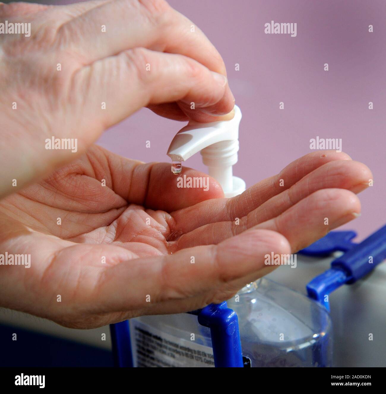 Hospital infection control. Close-up of a hand-cleaning gel dispenser ...