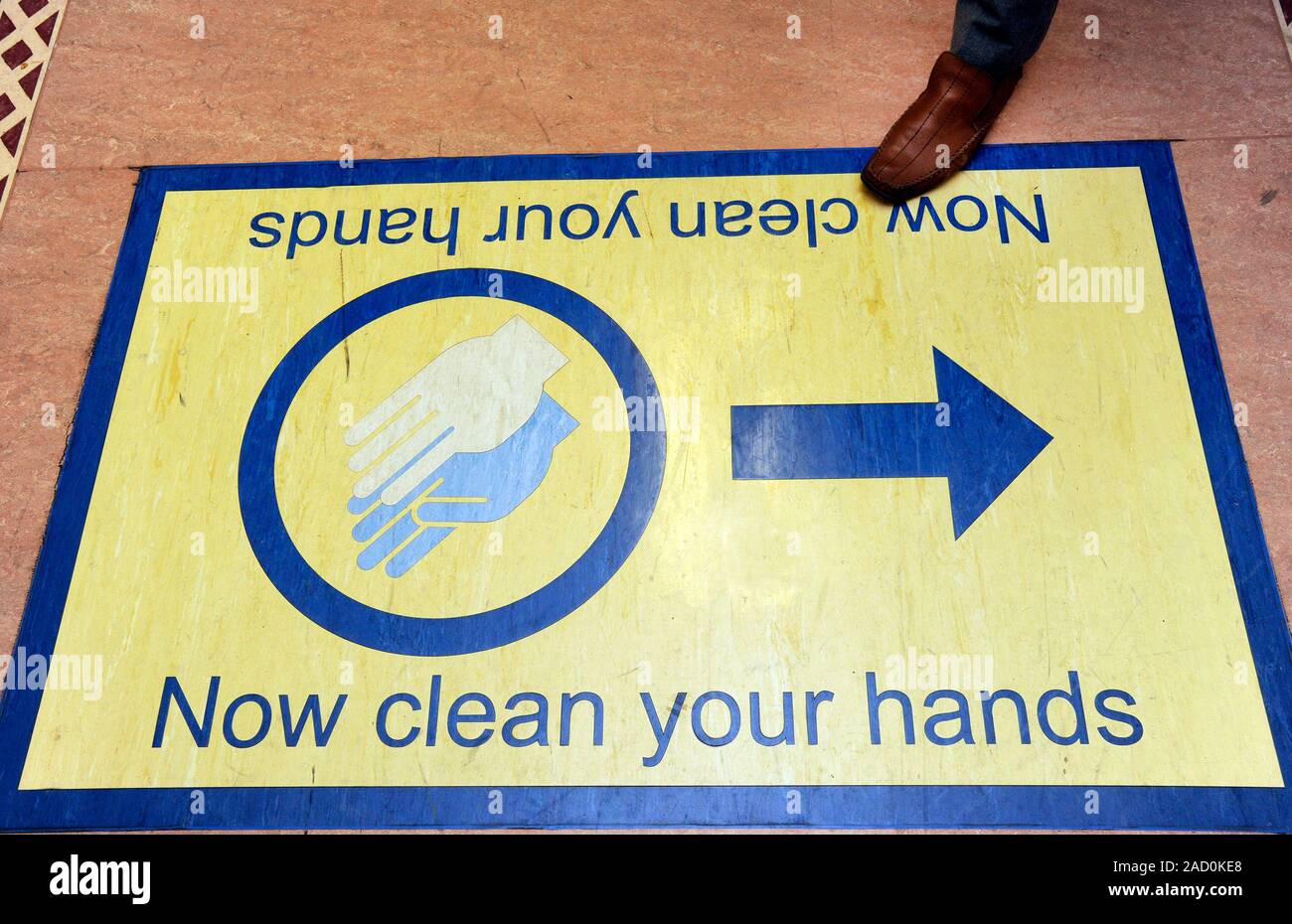 Hospital infection control. Floor sign in a hospital reminding medical ...