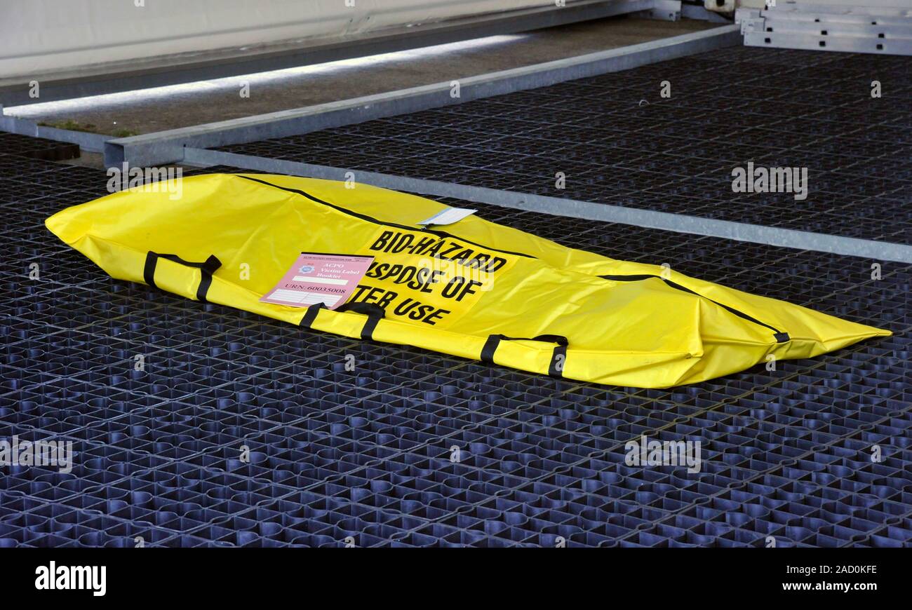 Radiation emergency response training. Body bag being used in training ...