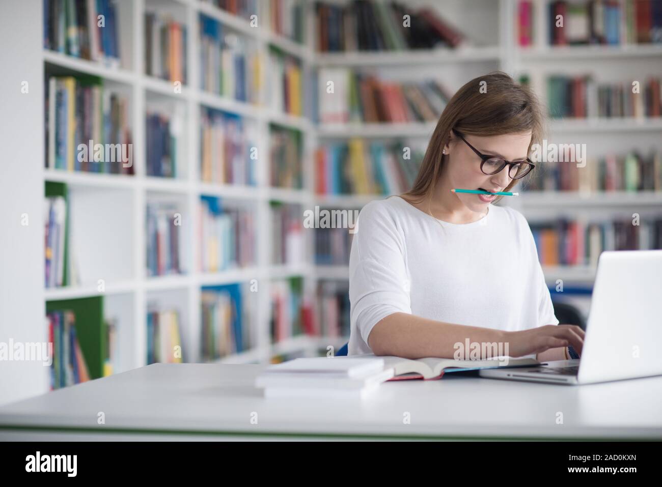 female student study in school library Stock Photo - Alamy