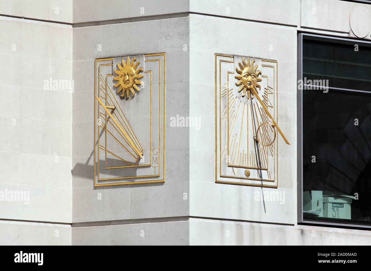 Sundials. Two sundials at right angles to each other on the wall of a ...
