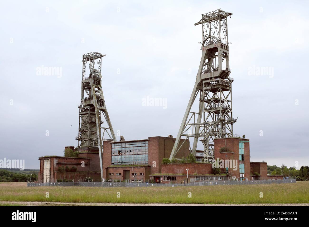 Disused coal mine. View of the disused buildings and headstocks of ...
