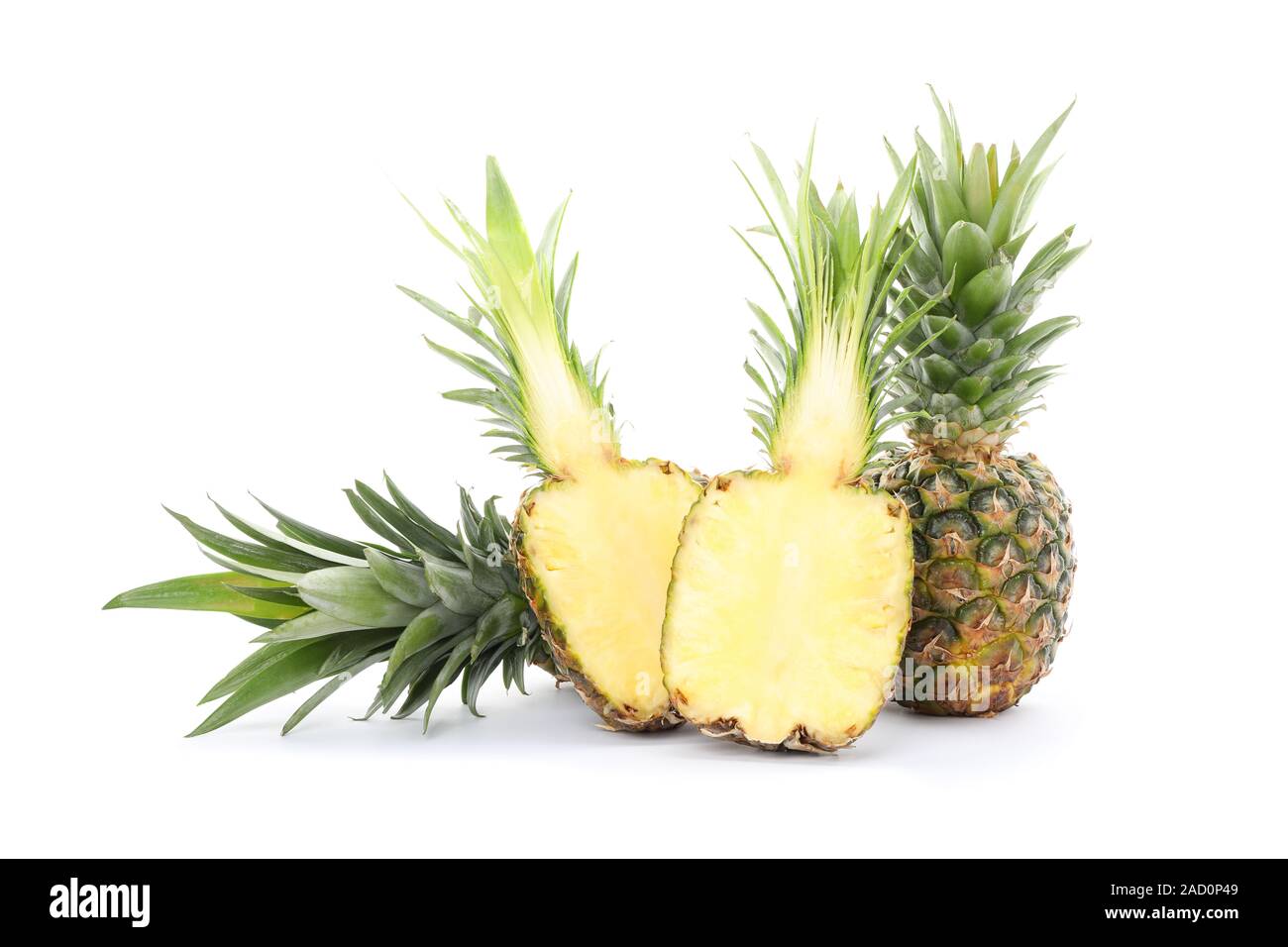 Pineapples and two halves isolated on white background. Juicy fruit ...