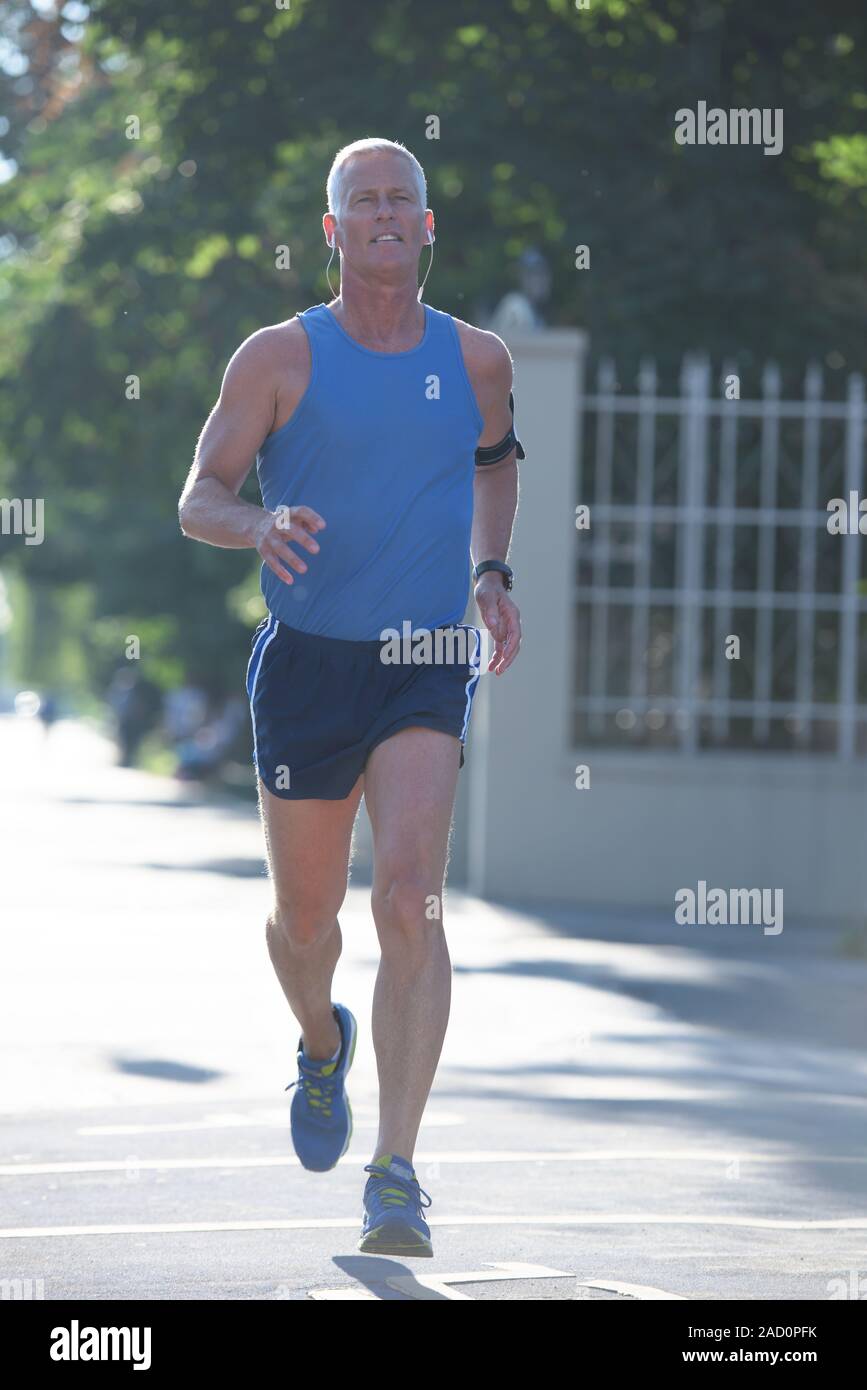 handsome senior man jogging Stock Photo - Alamy