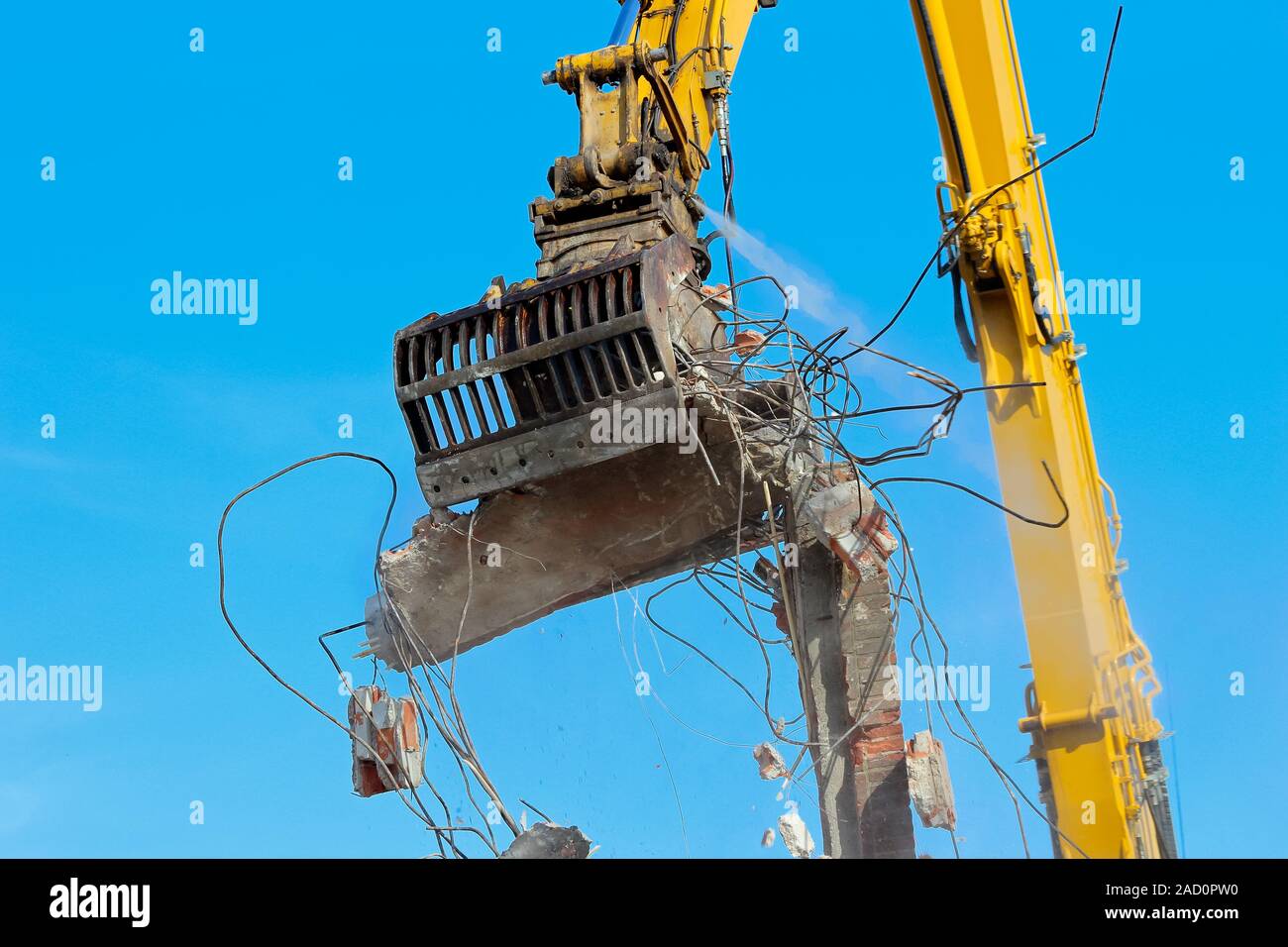 Large demolition crane claw dismantling a building Stock Photo - Alamy