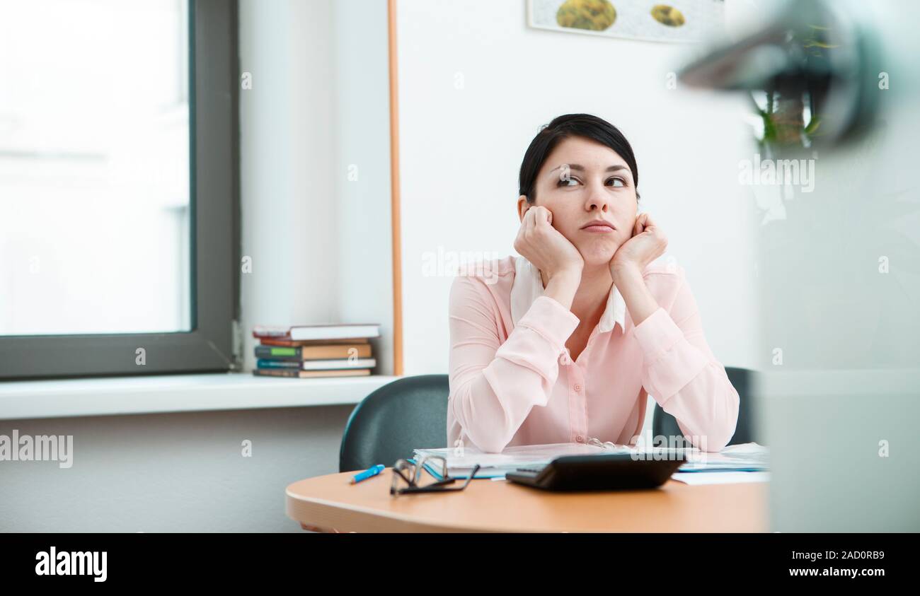 Young office worker dreaming in her workplace Stock Photo - Alamy