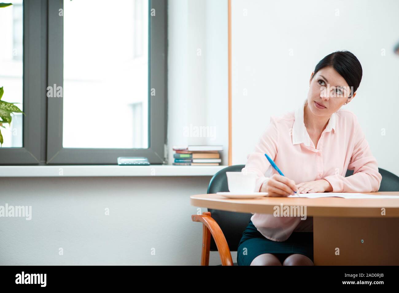 One woman writing paper light hi-res stock photography and images - Alamy