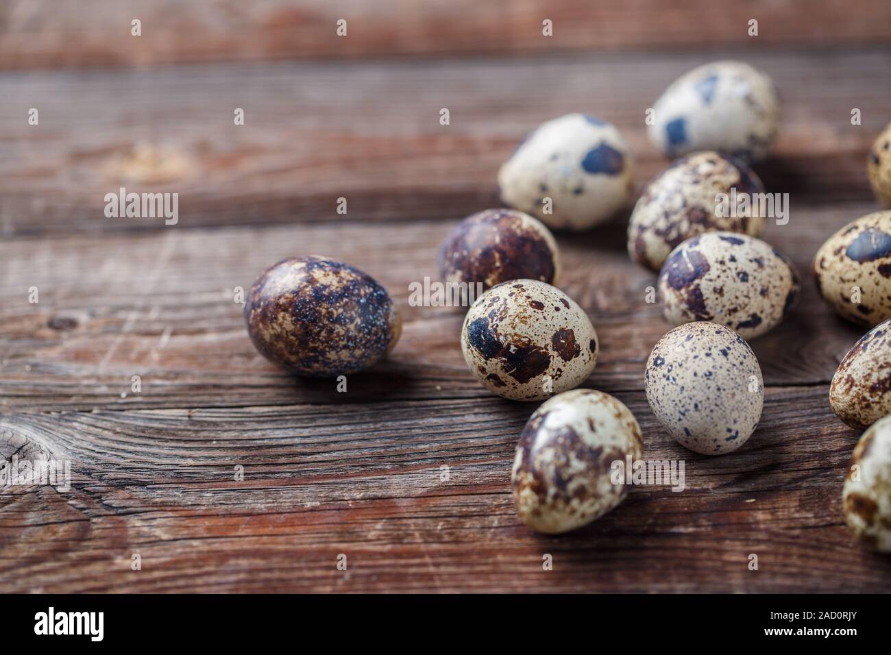 Group of quail eggs on thewooden background Stock Photo - Alamy