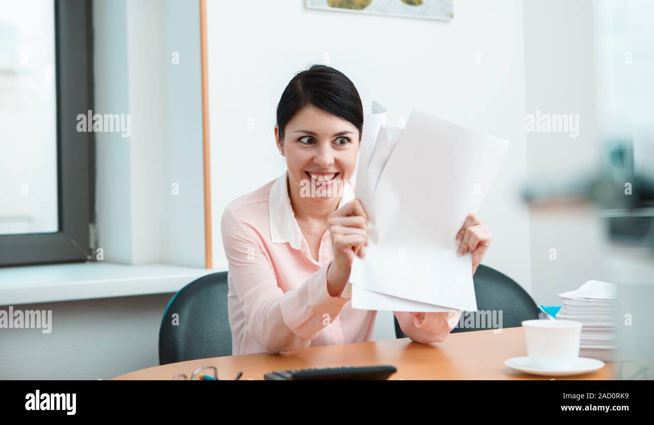 Woman throwing crumpled paper hi-res stock photography and images - Alamy
