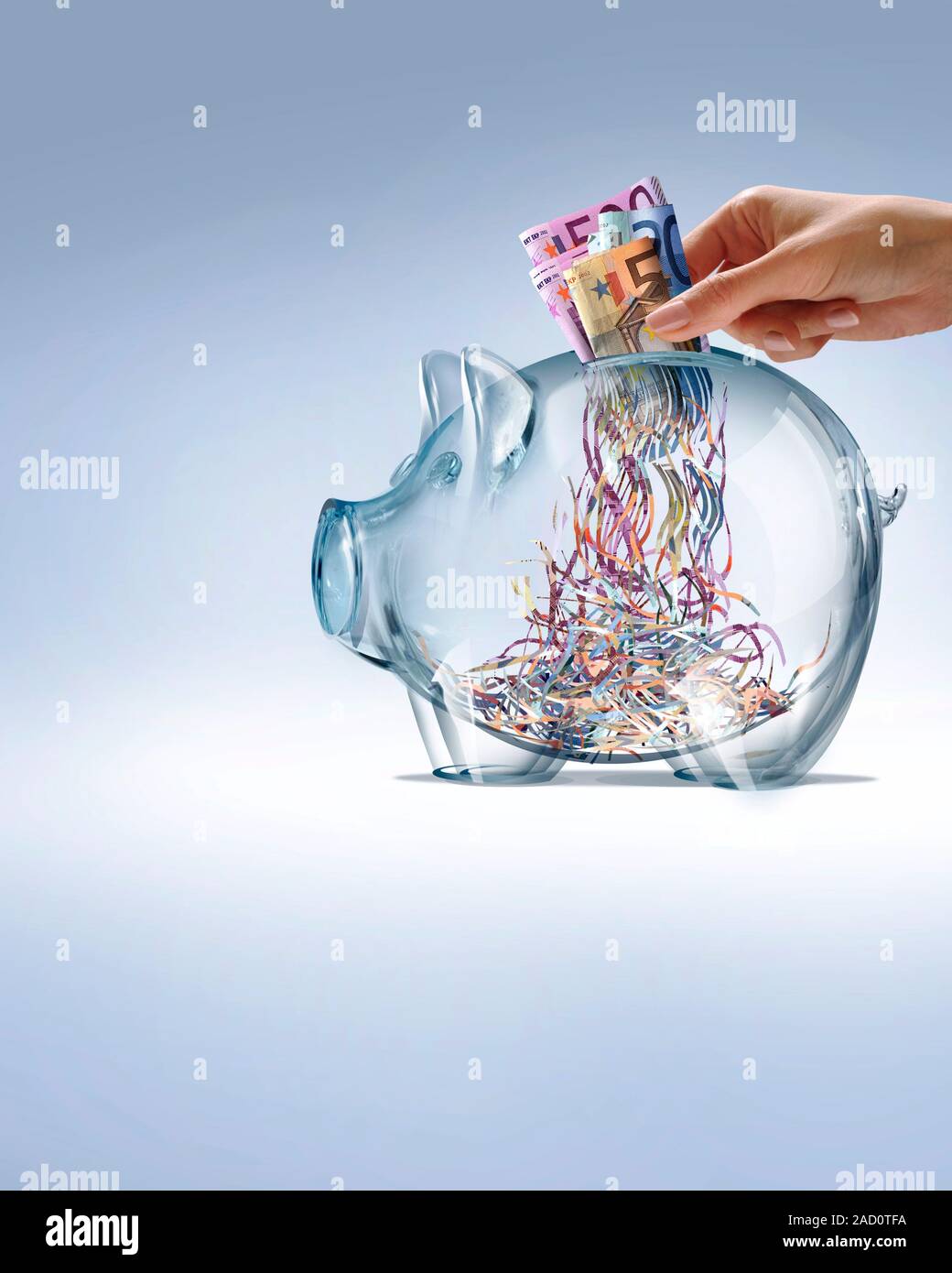 Euro savings crisis. Conceptual image of a piggy bank being used to ...