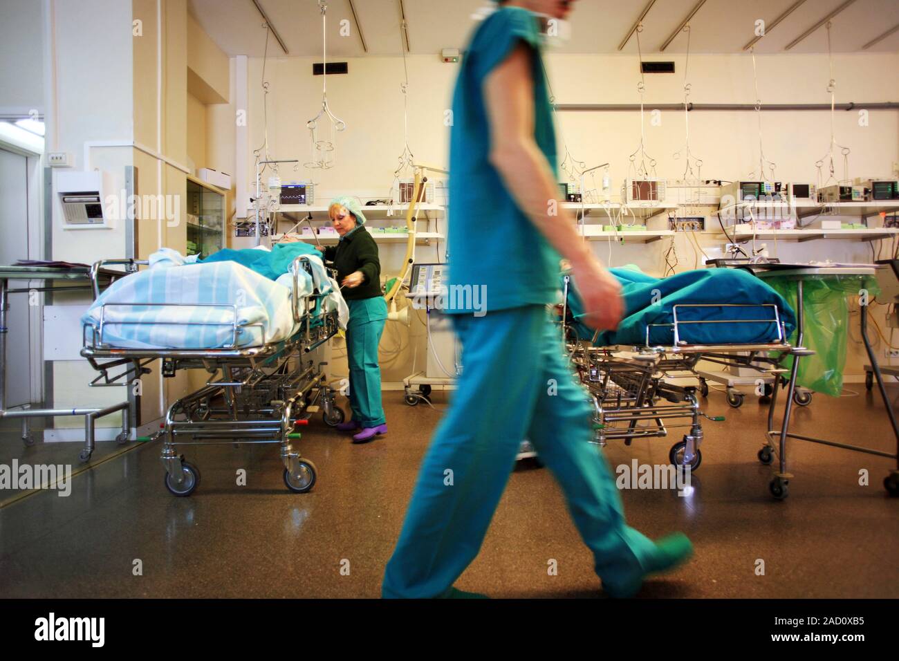 Surgical recovery room. Nurse with a patient recovering after an ...