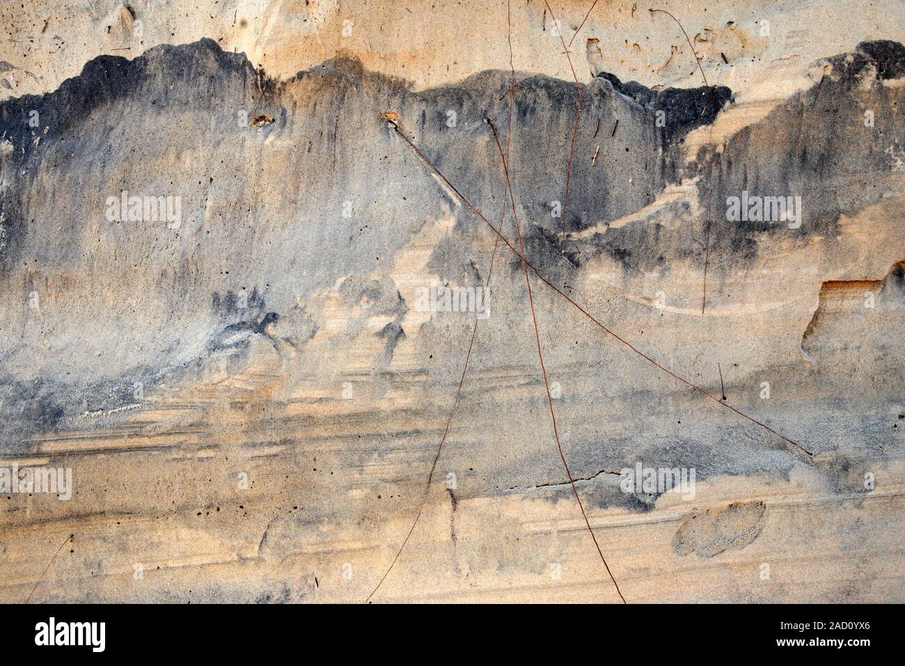 Titanium deposits on a beach. Close-up of titanium deposits in sand on ...