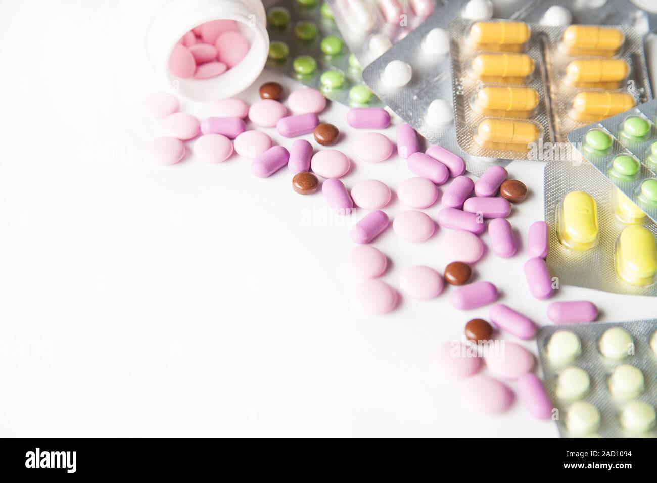 Colorful tablets on white background Stock Photo - Alamy
