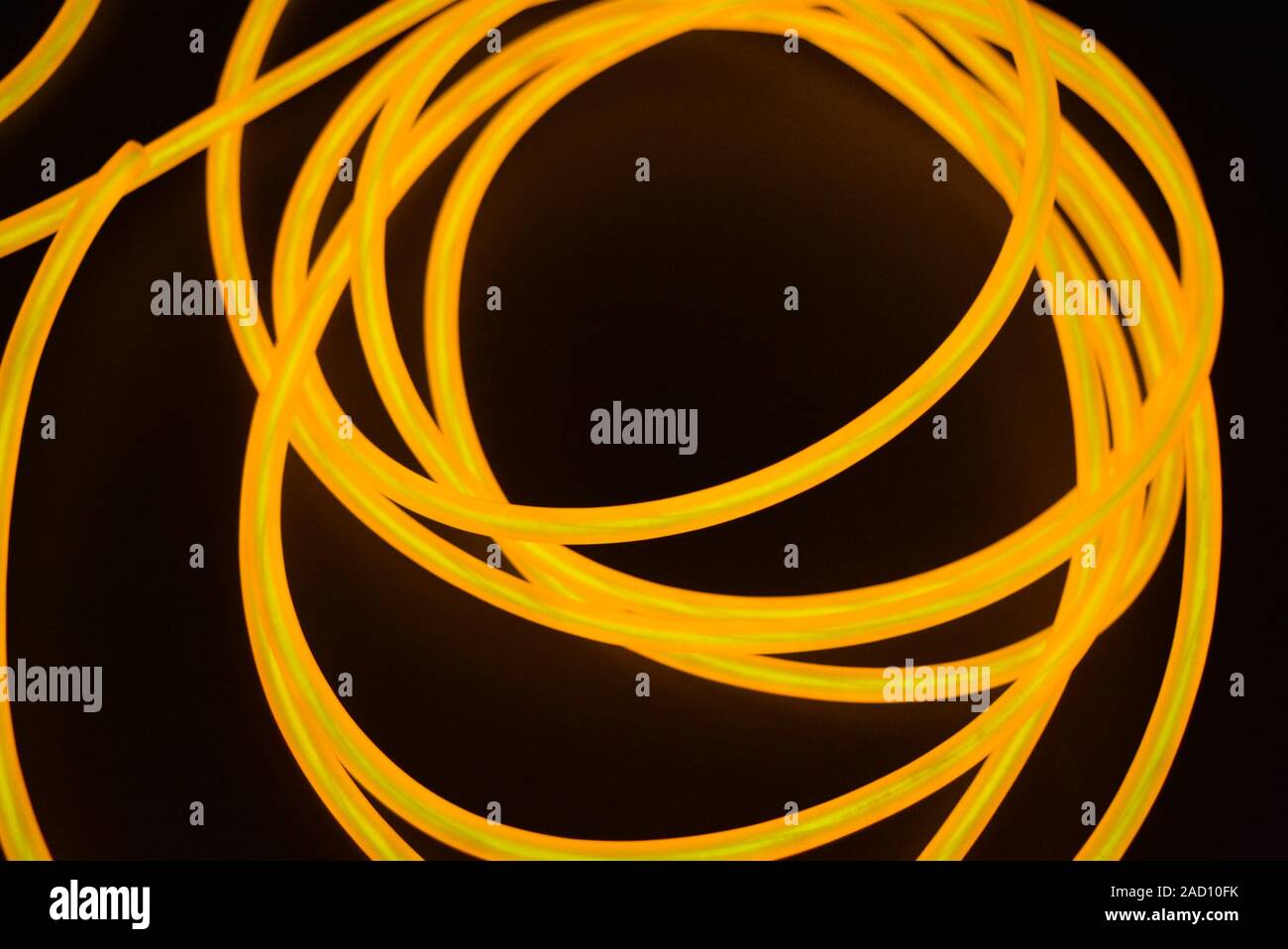 Bright orange luminous wire, twisted light wire, cable. Different ...