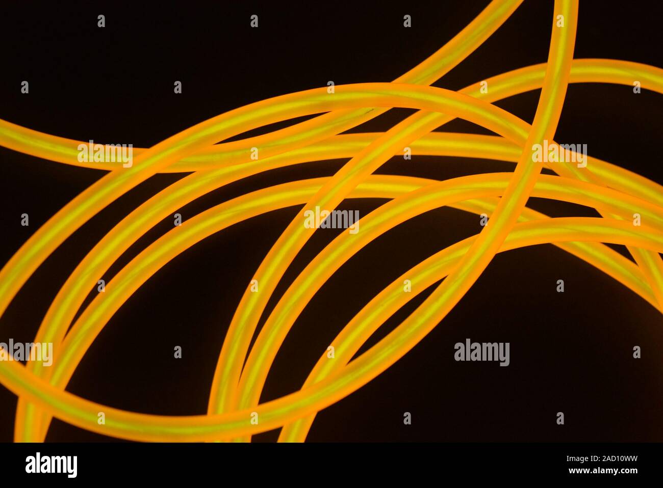 Bright orange luminous wire, twisted light wire, cable. Different ...