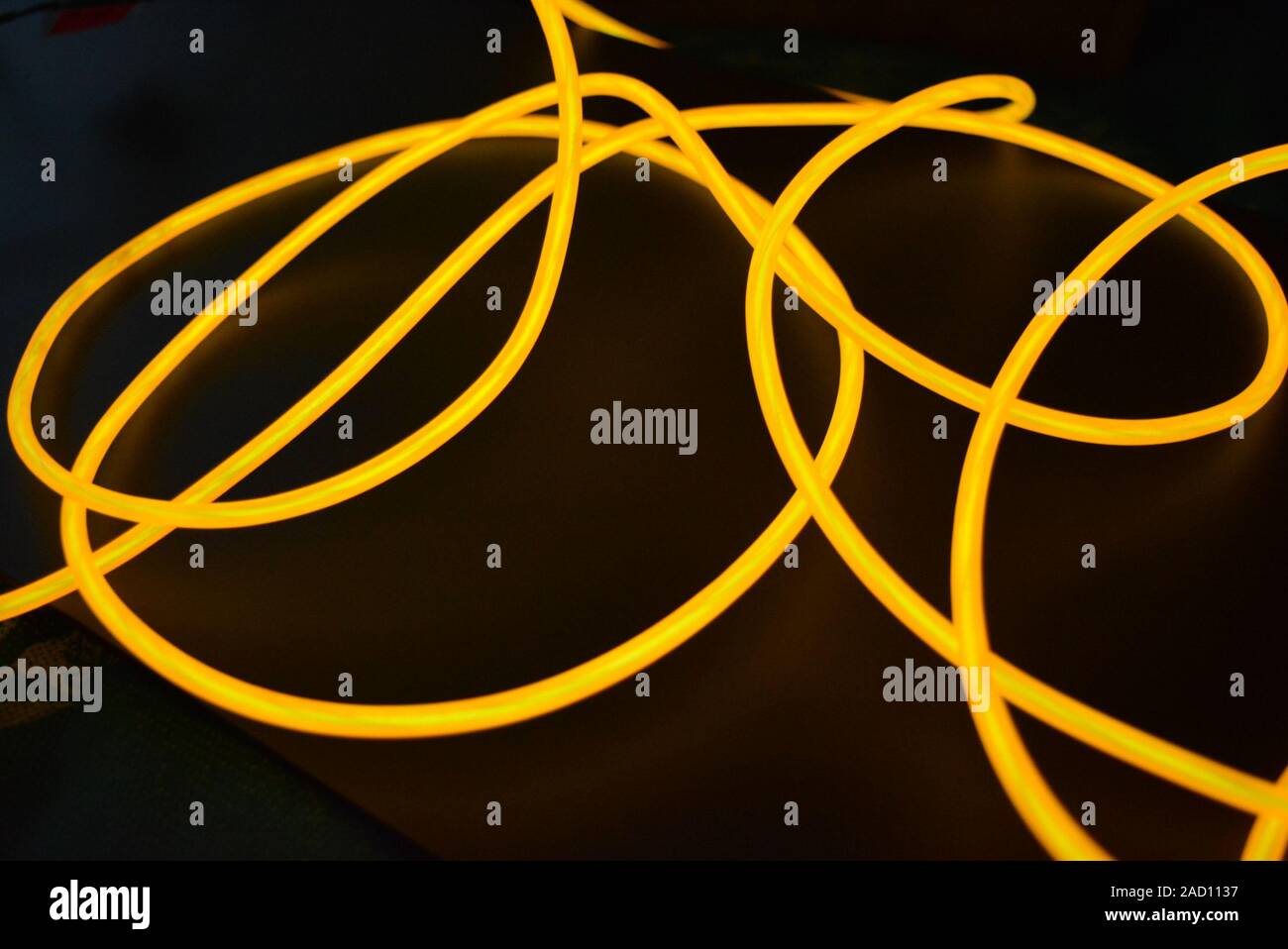 Bright orange luminous wire, twisted light wire, cable. Different ...