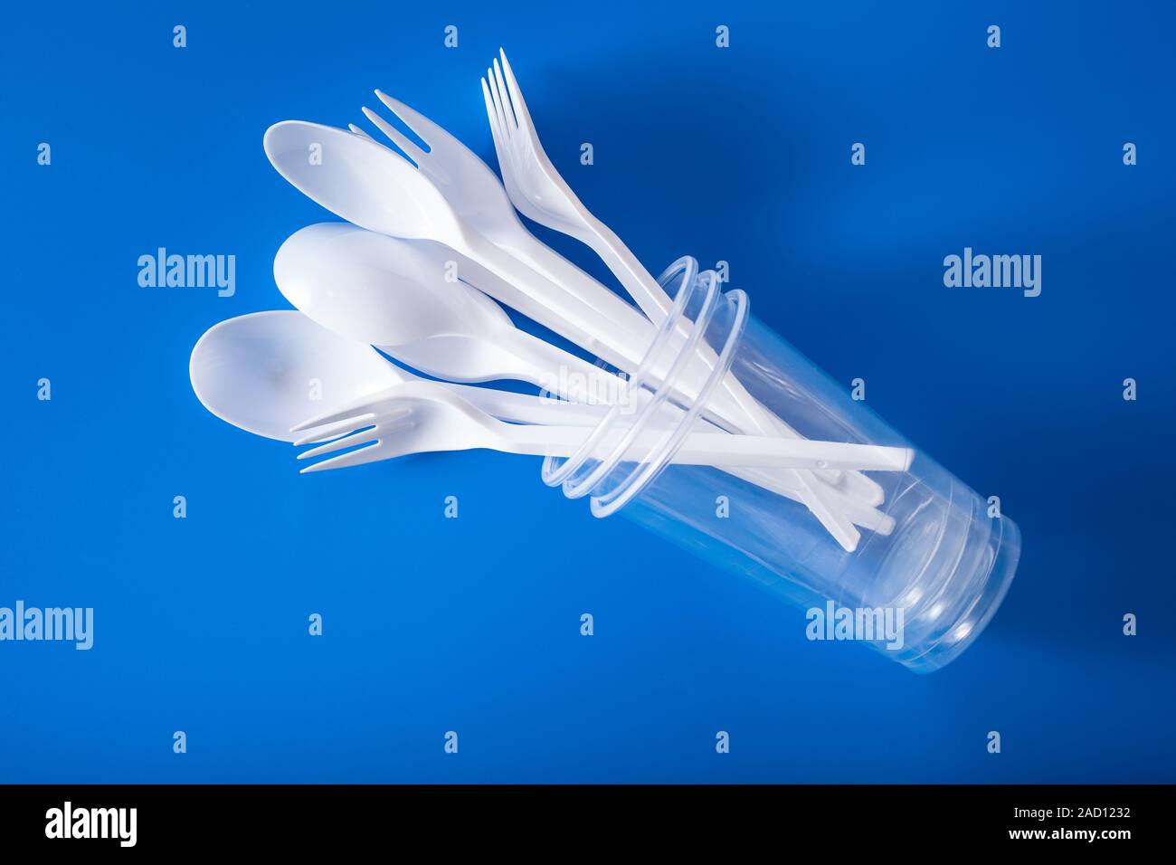 single use plastic cups, forks, spoons. concept of recycling plastic ...