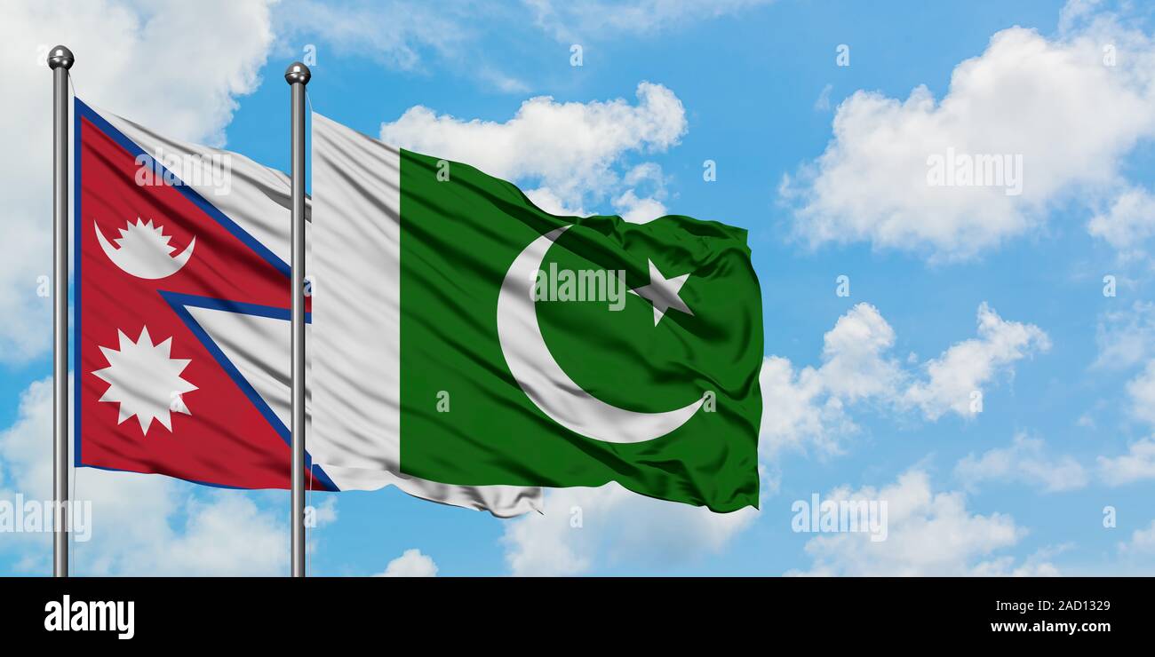 Nepal and Pakistan flag waving in the wind against white cloudy blue ...