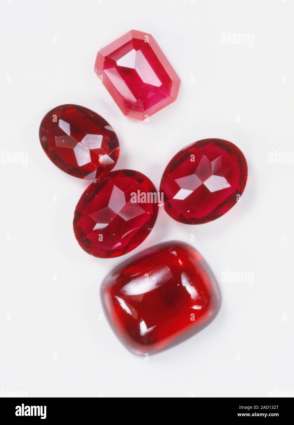 Five polished ruby gemstones Stock Photo - Alamy