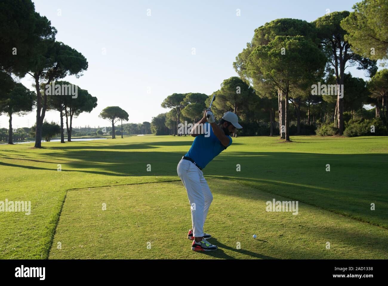 golf player hitting shot Stock Photo - Alamy