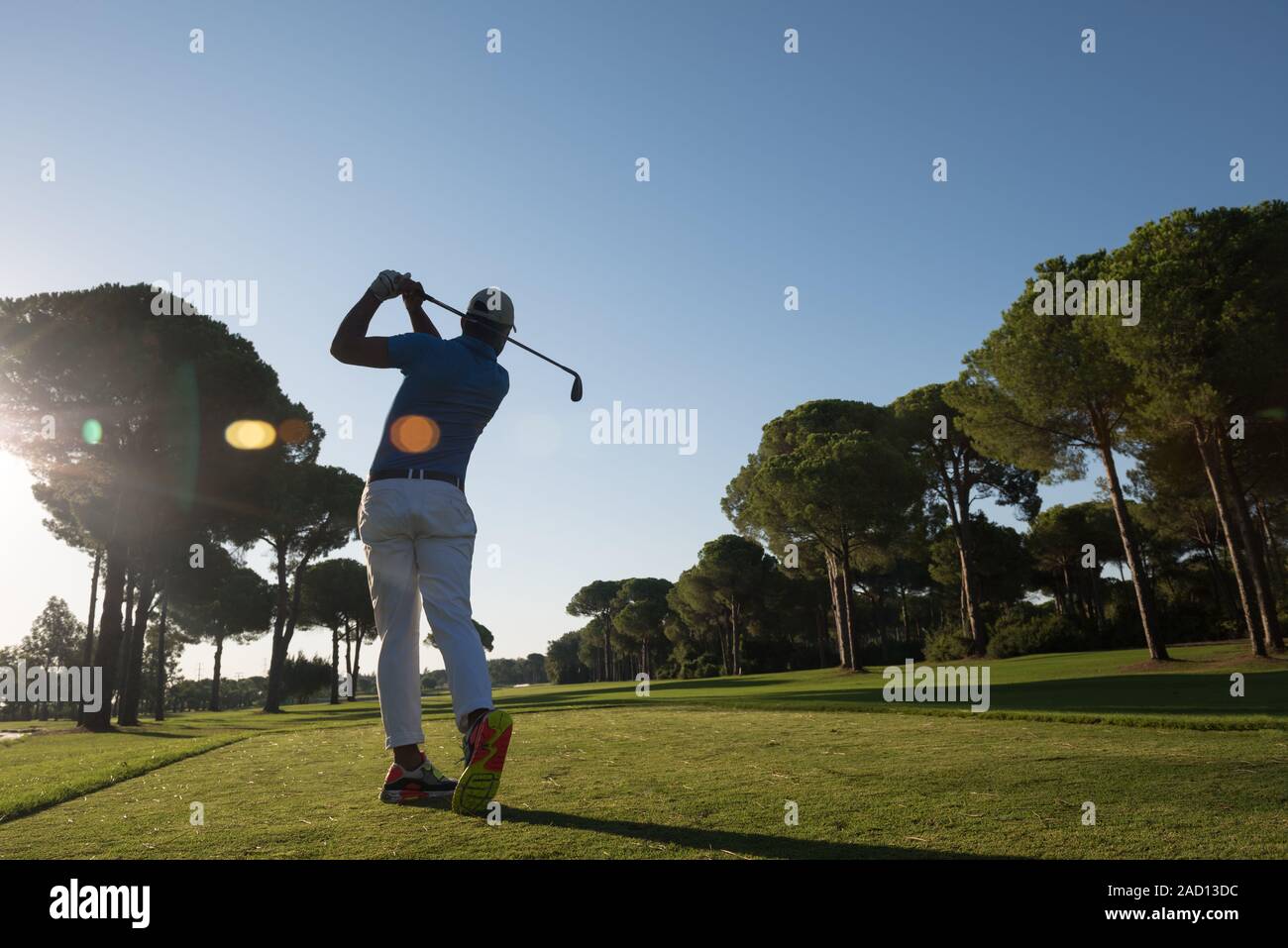 golf player hitting shot Stock Photo - Alamy