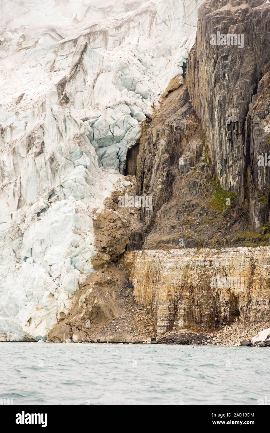 A glacier at Alkefjellet in northern Svalbard. At the side of the ...