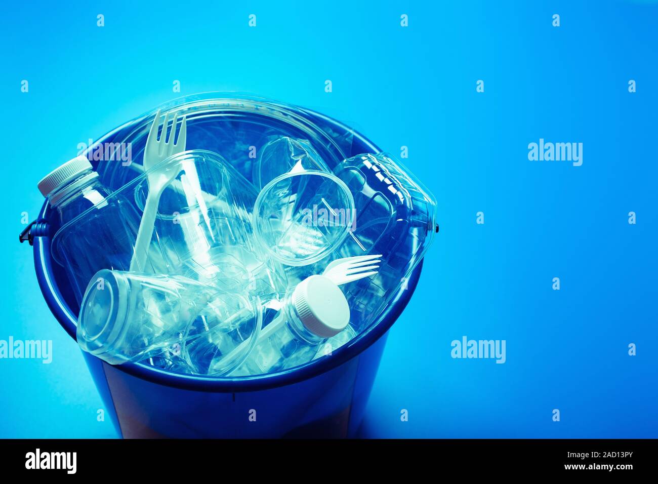 clean recyclable plastic bottles, containers, cups in garbage bin ...