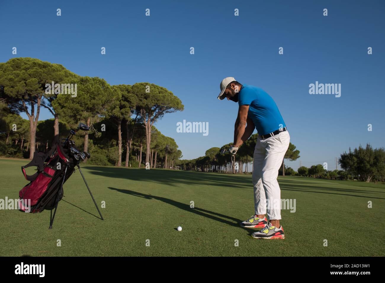 golf player hitting shot Stock Photo - Alamy
