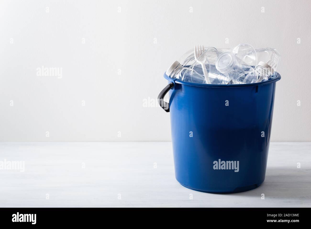 clean recyclable plastic bottles, containers, cups in garbage bin ...